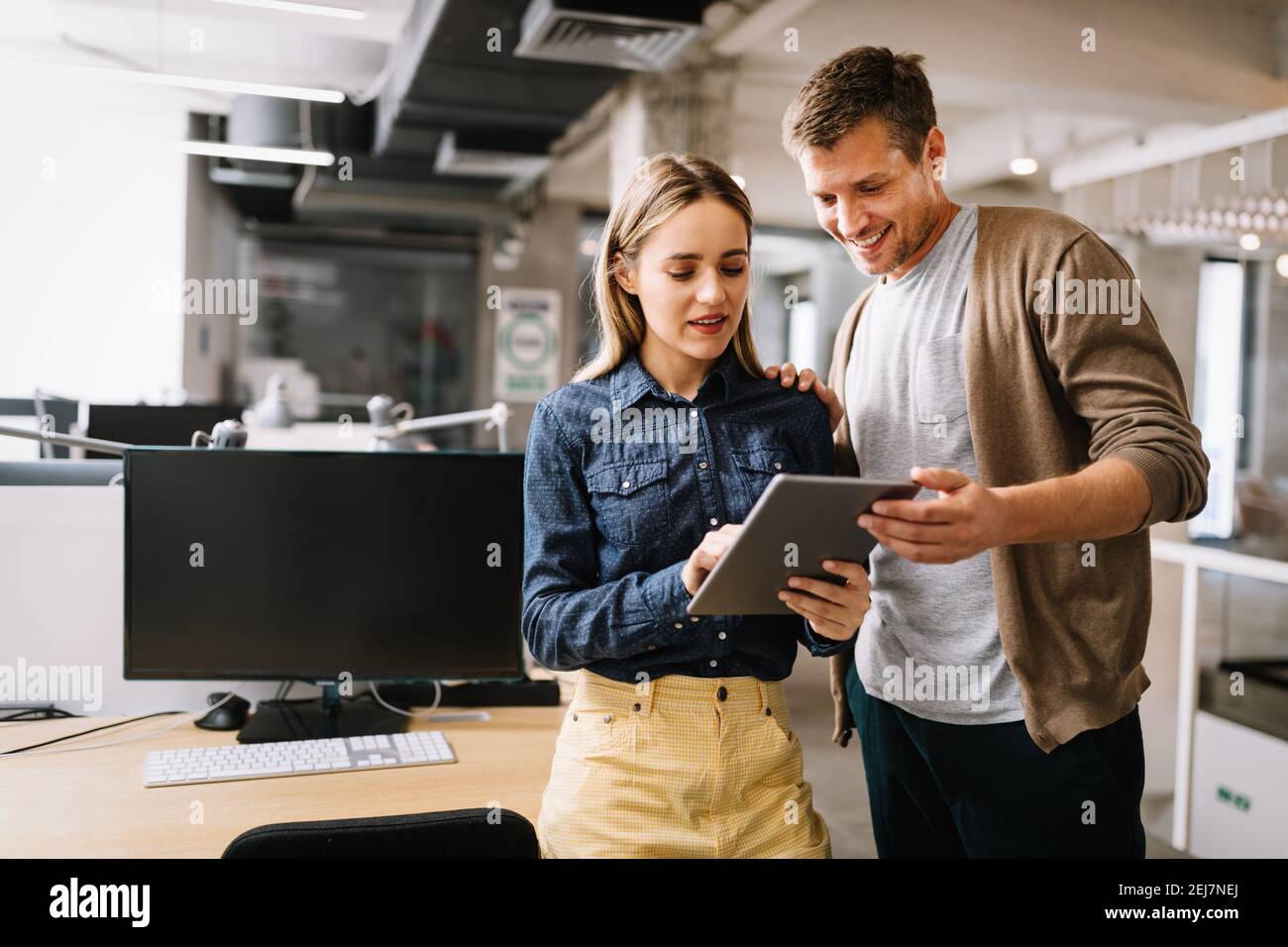 Programmers cooperating at IT company developing apps Stock Photo - Alamy