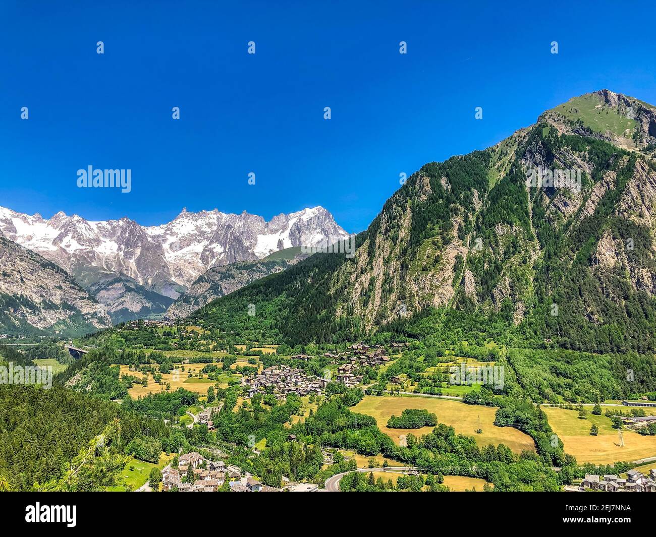 Aerial view of small village surrounded by beautiful nature scenes in ...