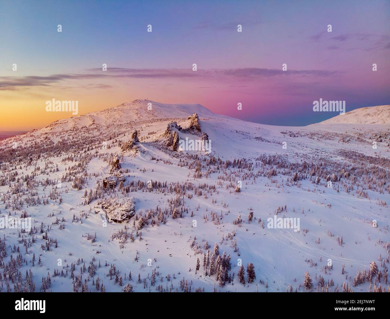 Colorful winter sunset in Sheregesh ski resort mountains with clouds ...