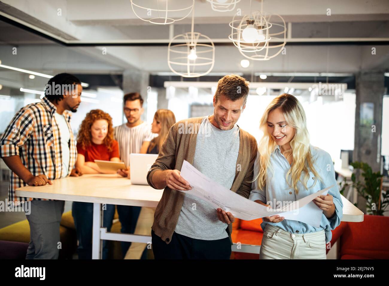 Happy creative team in office. Business, startup, design, people and ...