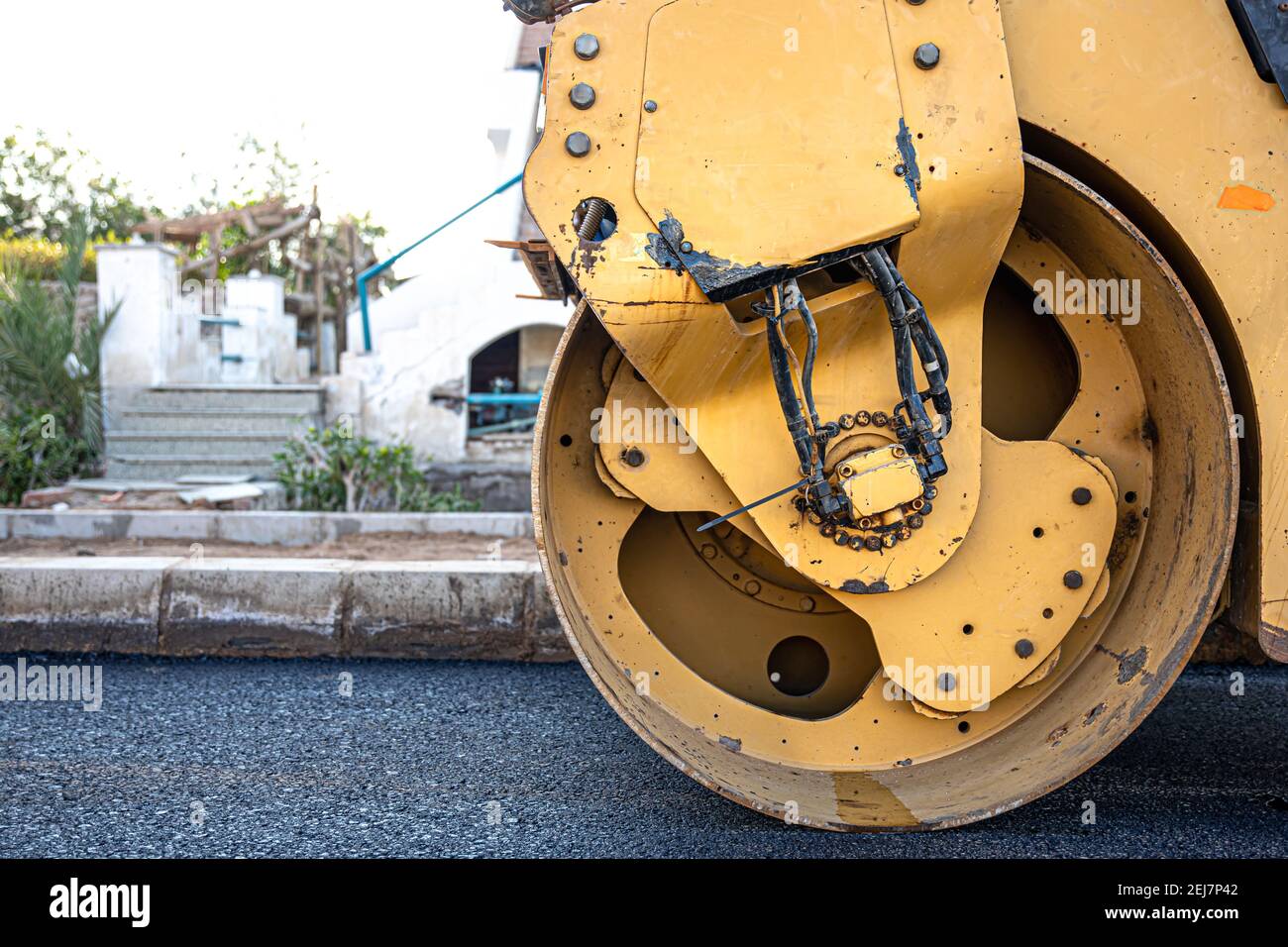 Road roller makes the paving. Road roller compacting asphalt. Roller ...