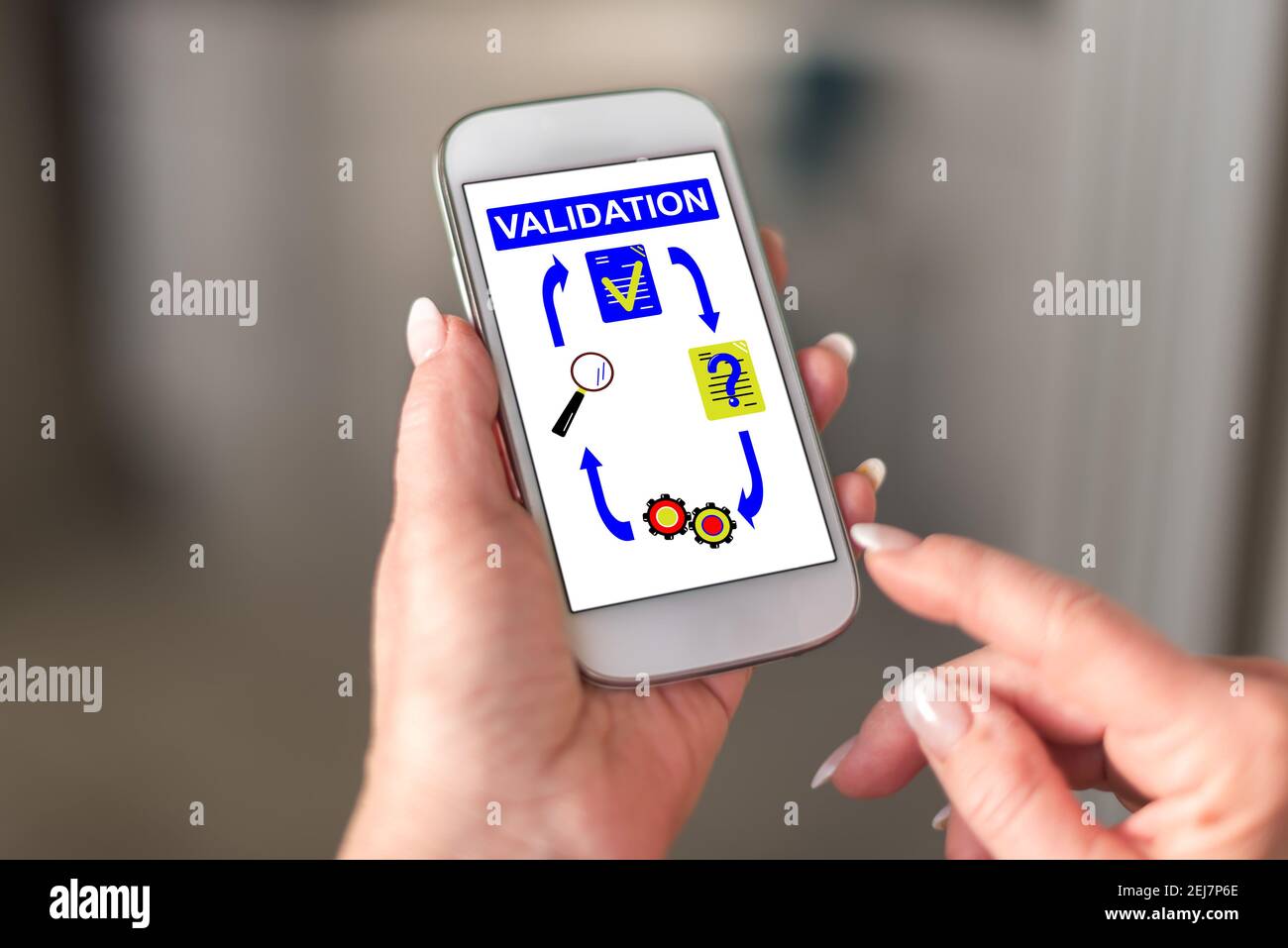 Validation concept on a smartphone held by a hand Stock Photo - Alamy