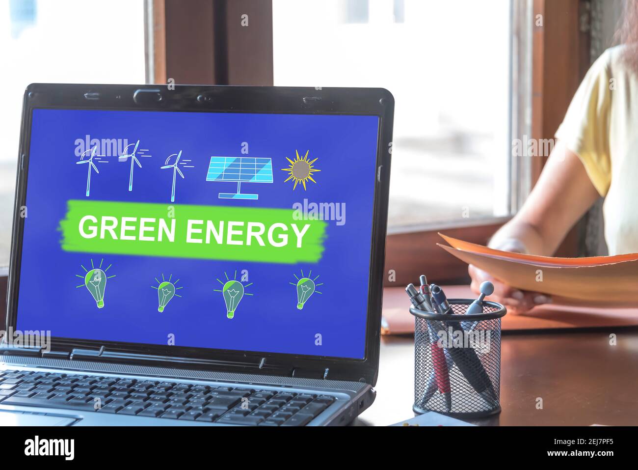 Laptop screen displaying a green energy concept Stock Photo - Alamy