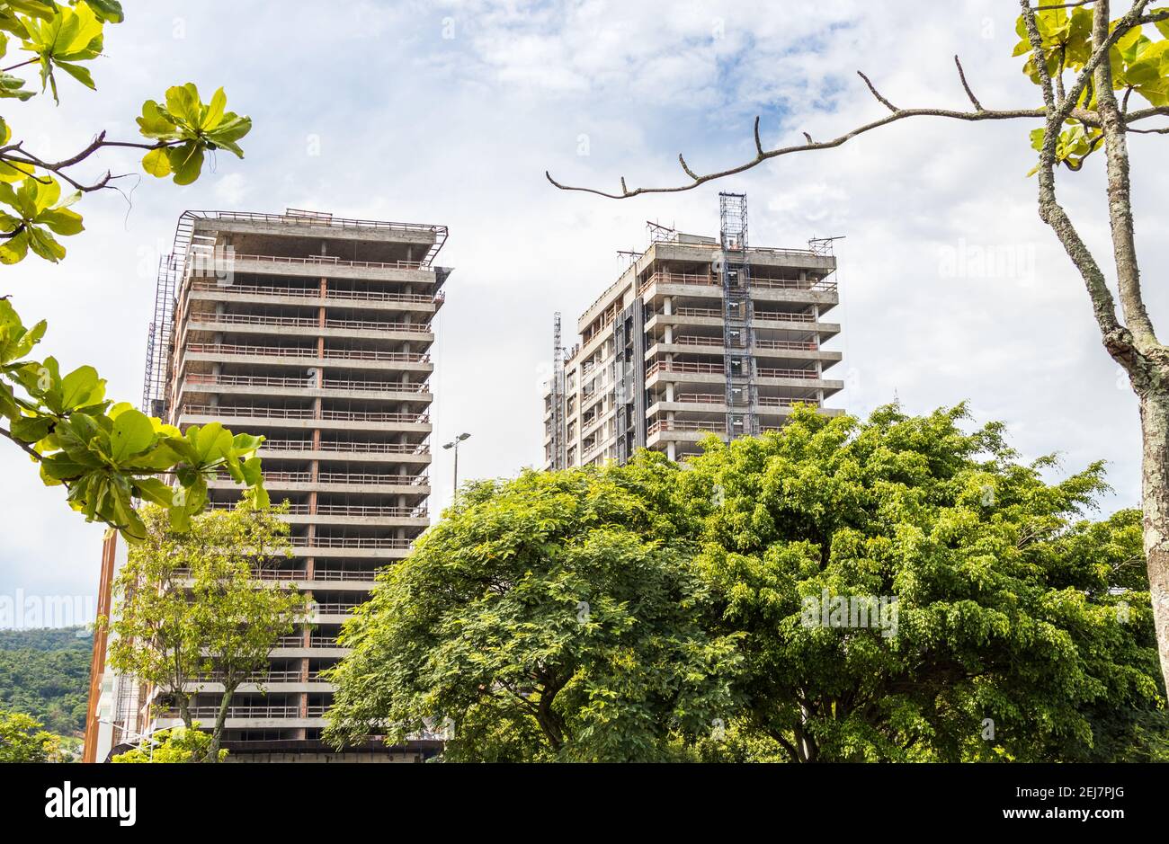 Low angle shot of two high-rise buildings under constructi Stock Photo ...