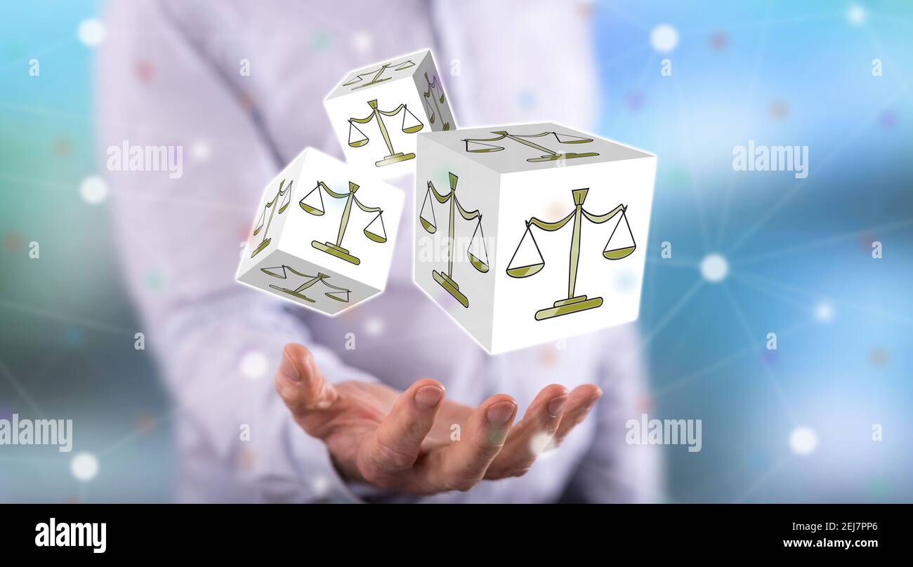 Justice concept above the hand of a man in background Stock Photo - Alamy
