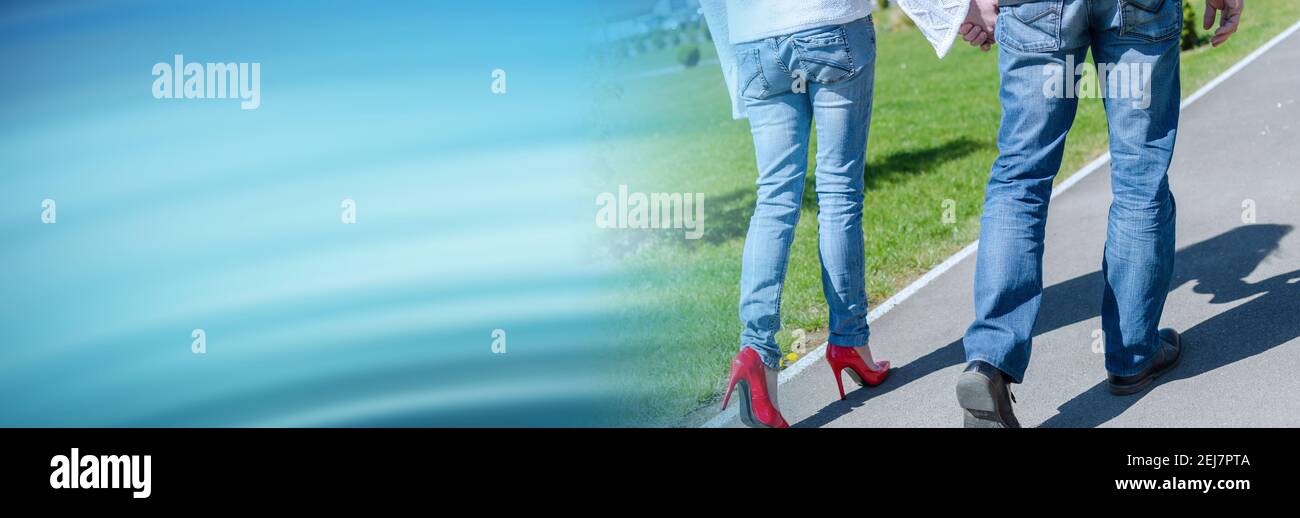 Couple walking hand in hand; panoramic banner Stock Photo - Alamy