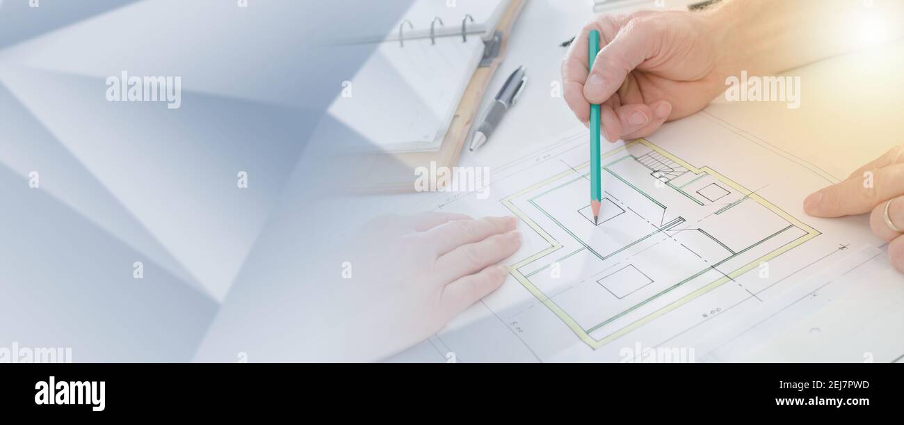 Architect showing house plans to his client; light effect Stock Photo ...