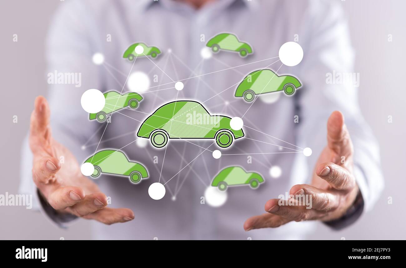 Connected car concept above the hands of a man in background Stock ...