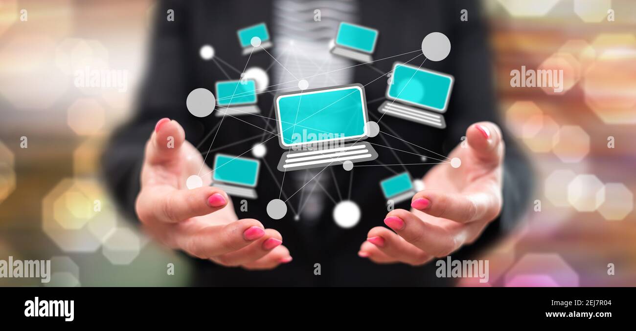 Devices connection concept above the hands of a woman in background ...