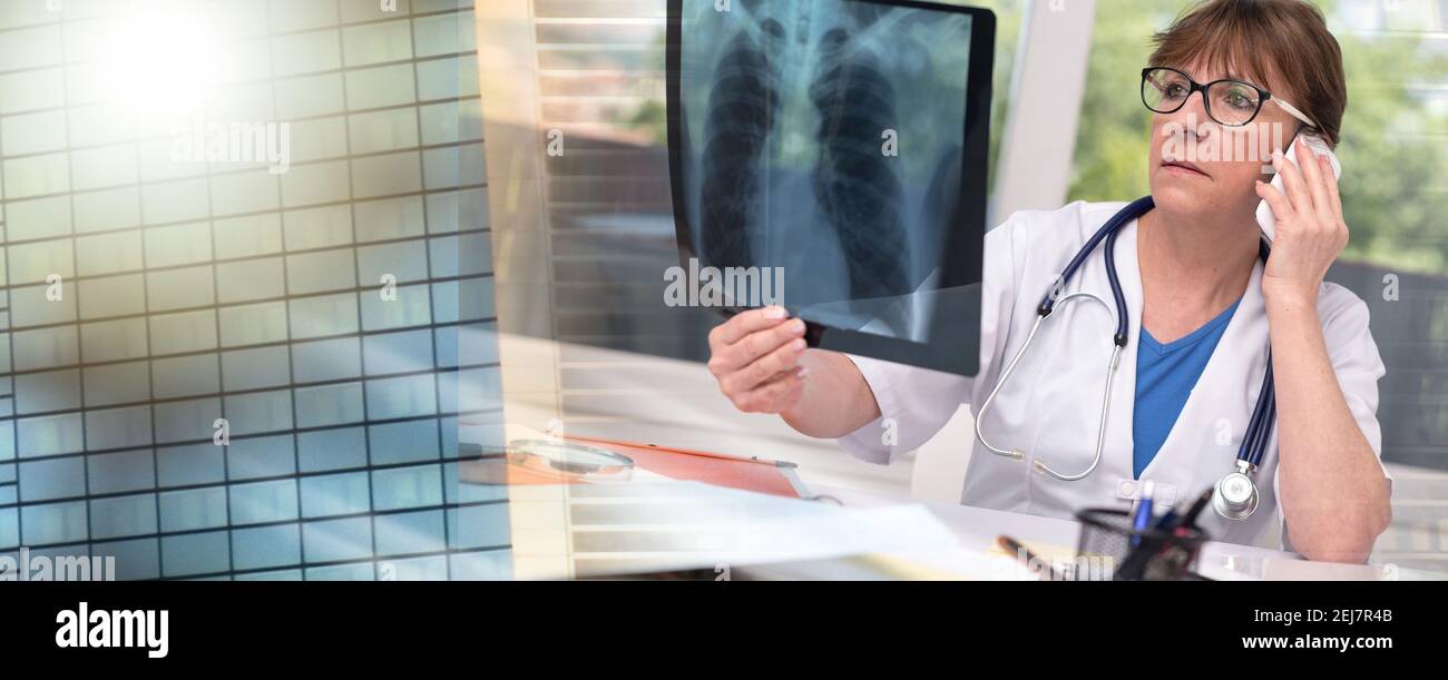 Female doctor examining x-ray report in medical office; multiple ...