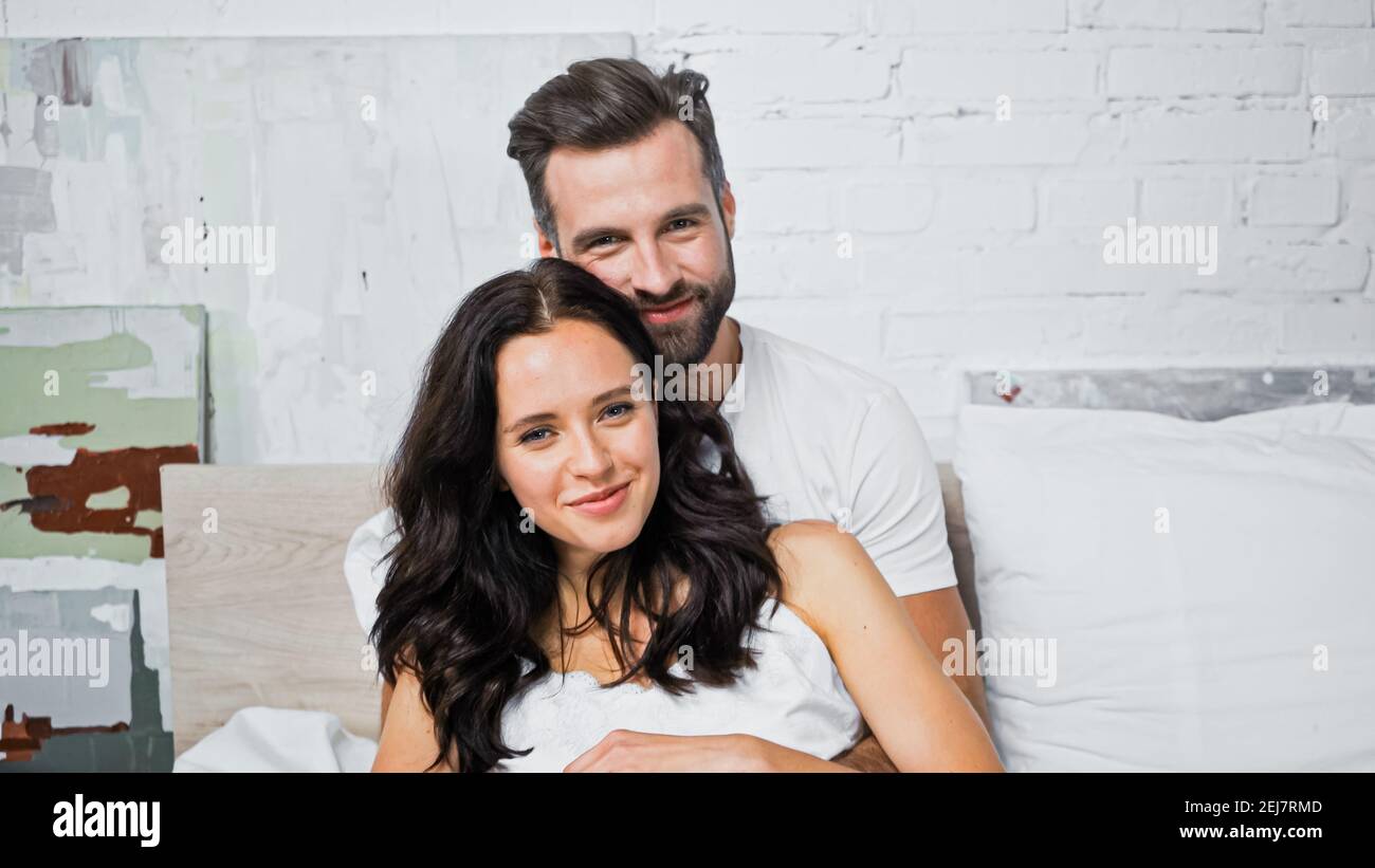 Attractive couple smiling camera hi-res stock photography and images ...