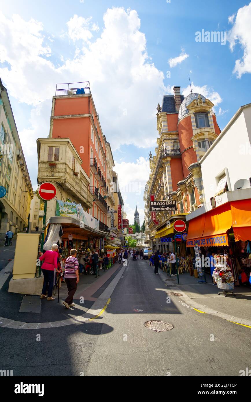 Lourdes, France - 05 2018. Pilgrims in the streets of Lourdes, France ...