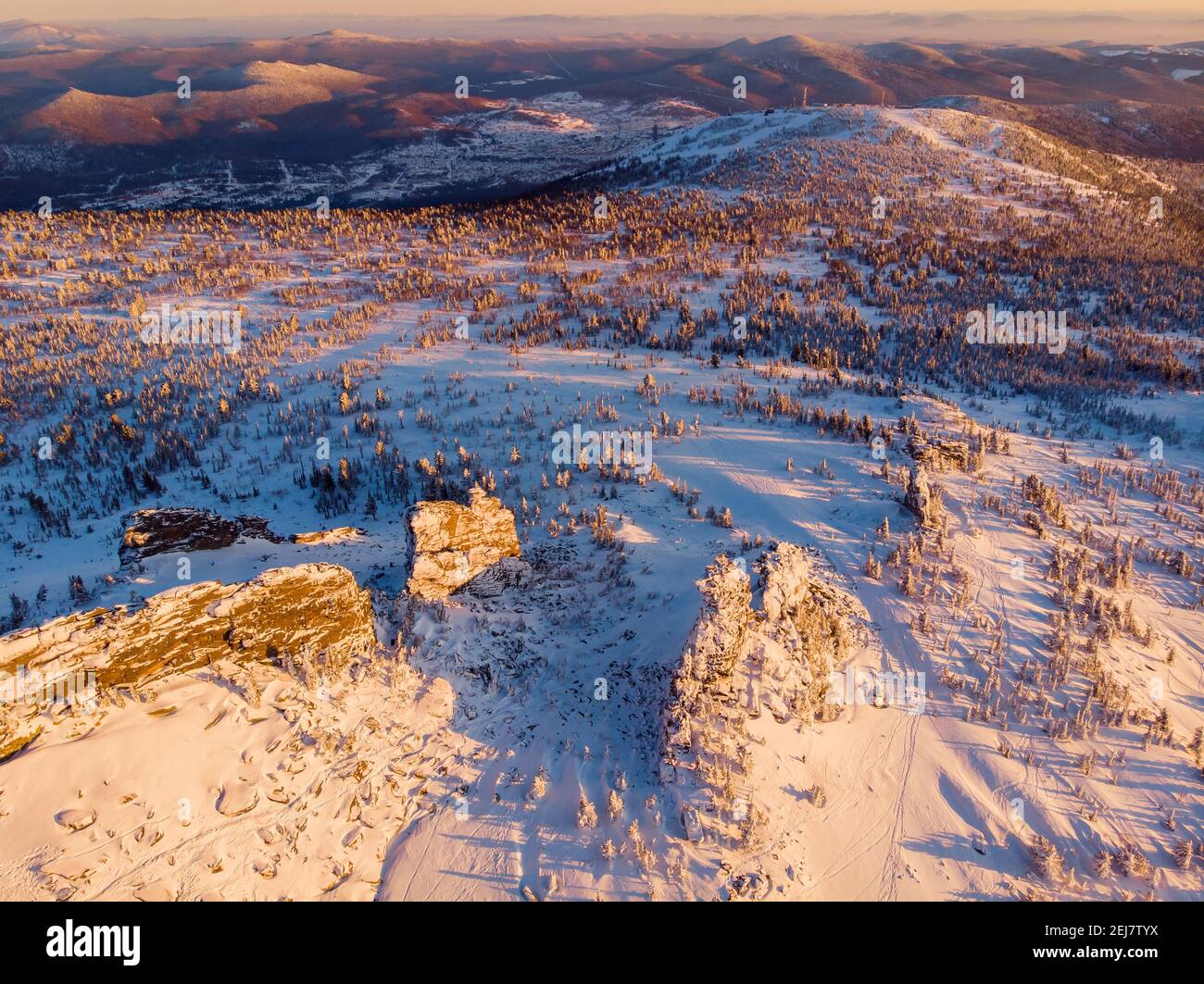 Colorful winter sunset in Sheregesh ski resort mountains with clouds ...