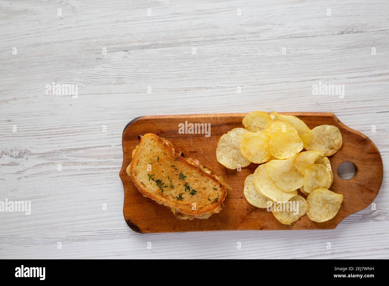 Homemade French Onion Melt Cheese Sandwich with Chips on a rustic ...