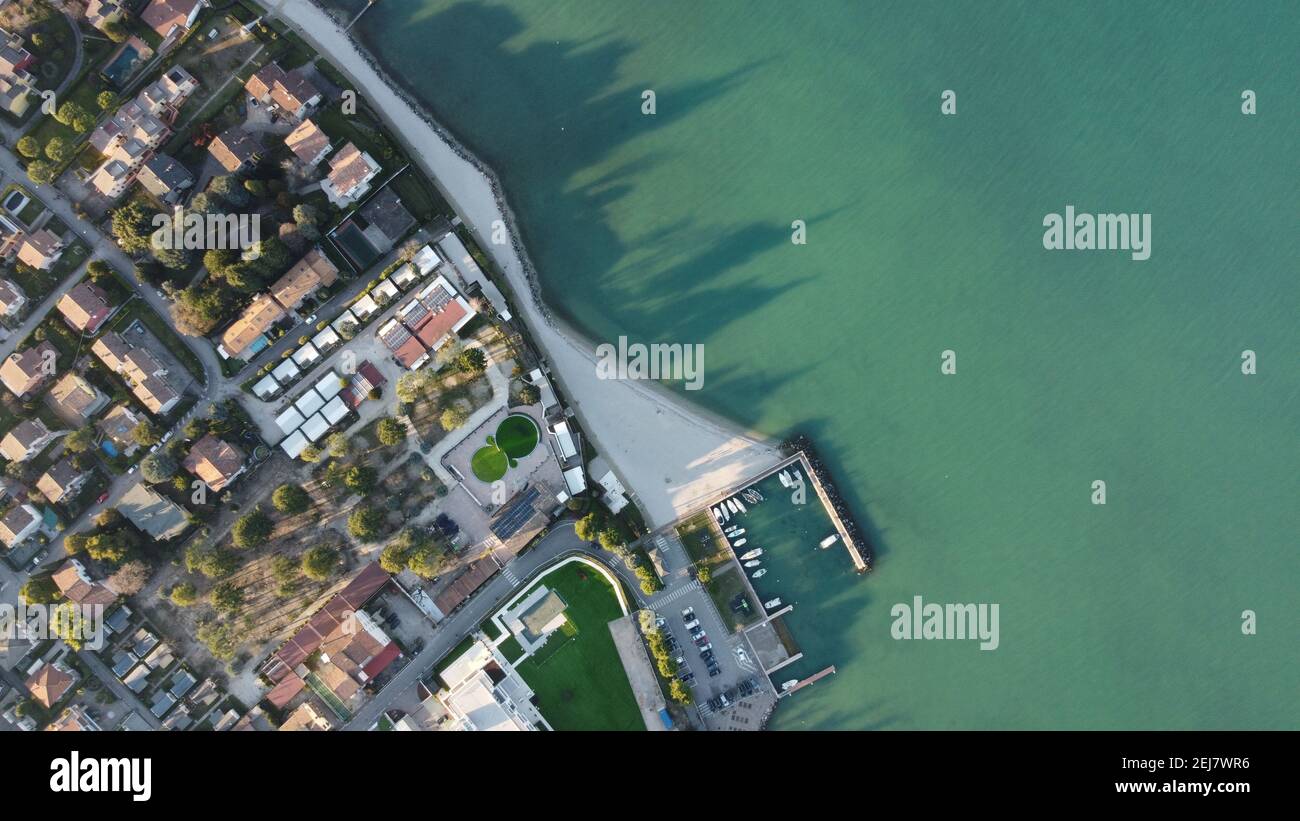Top view of a residential neighborhood by the sea captured during the ...
