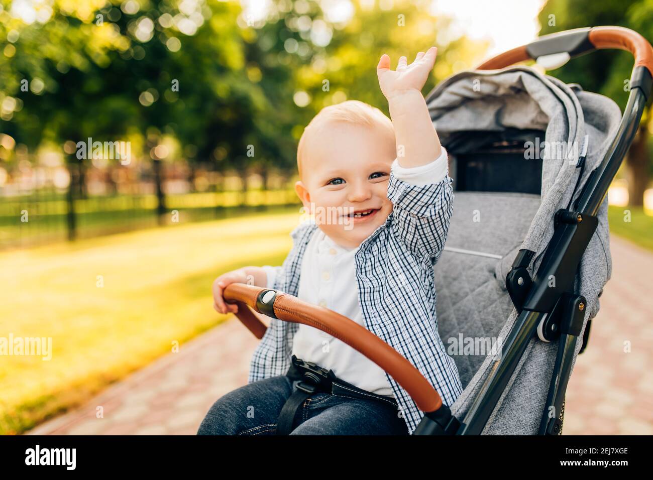 Portrait of smiling happy beautiful little child outdoors on summer day ...