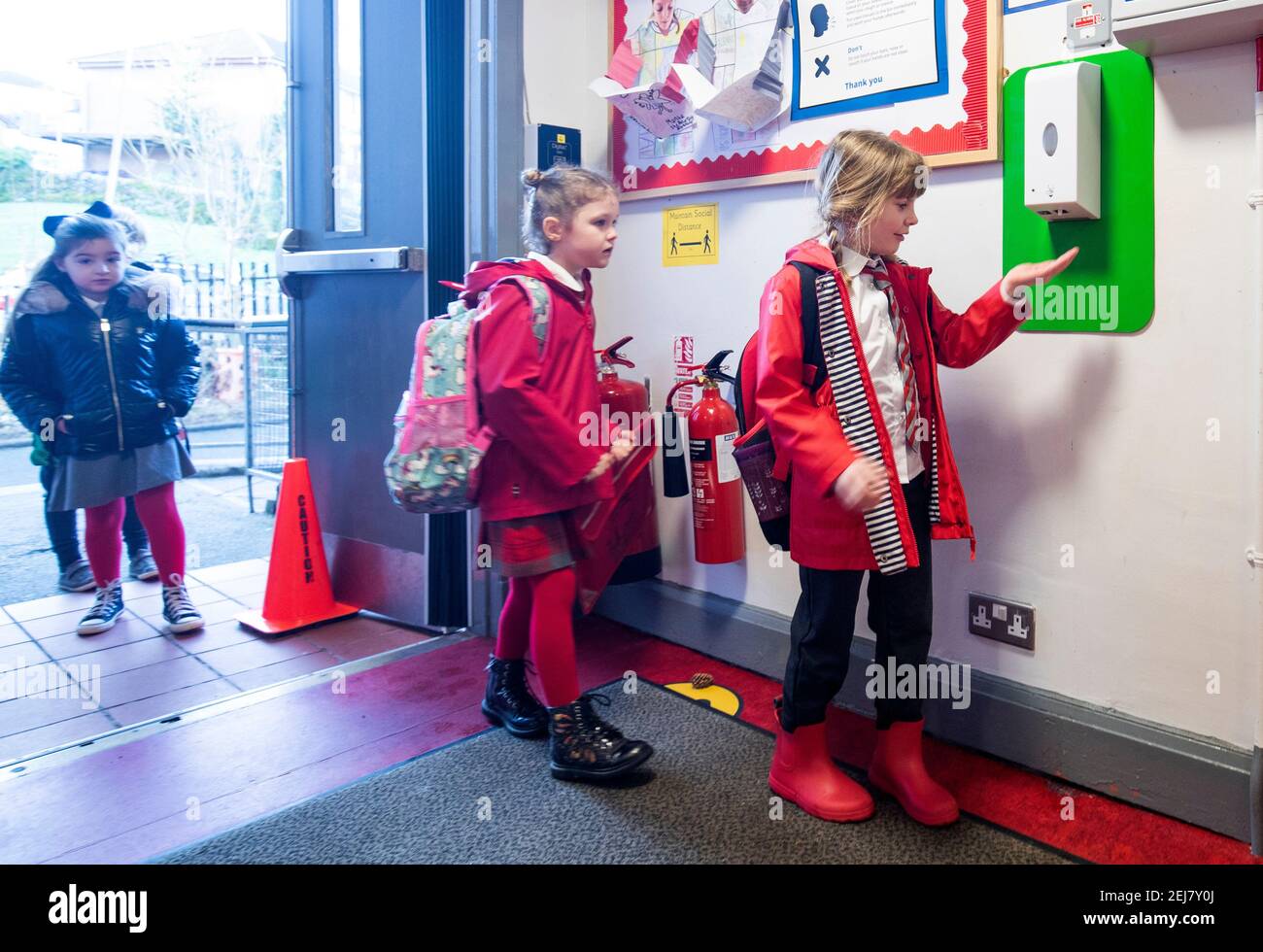 Pupils wash their hands as they arrive for their first day back at ...