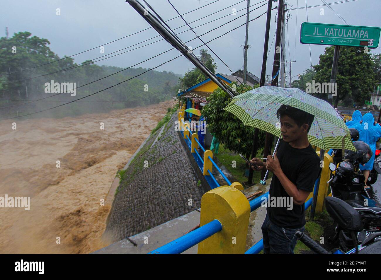 People watch a high volume of water at Katulampa Dam on January 1, 2020, at Katulampa Dam, Bogor ...