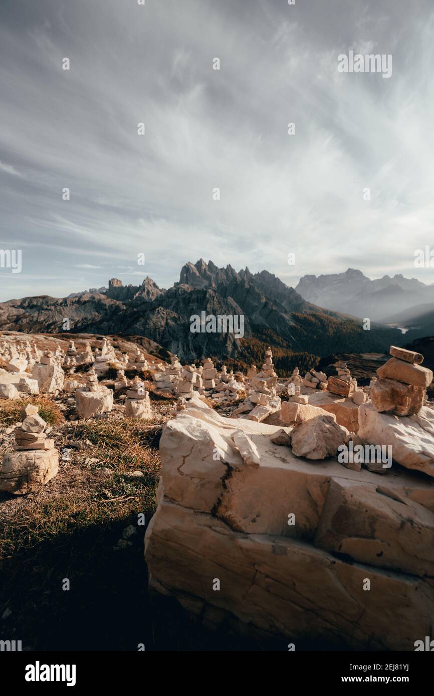 Majestic vertical shot of balanced stone pyramids in the Dolomites ...