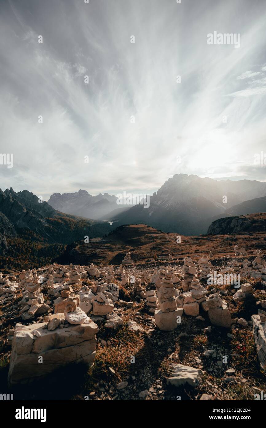 Majestic vertical shot of balanced stone pyramids in the Dolomites ...