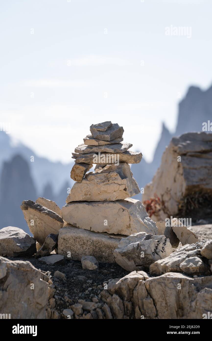 Closeup vertical shot of a balanced stone pyramid in the Dolomites ...