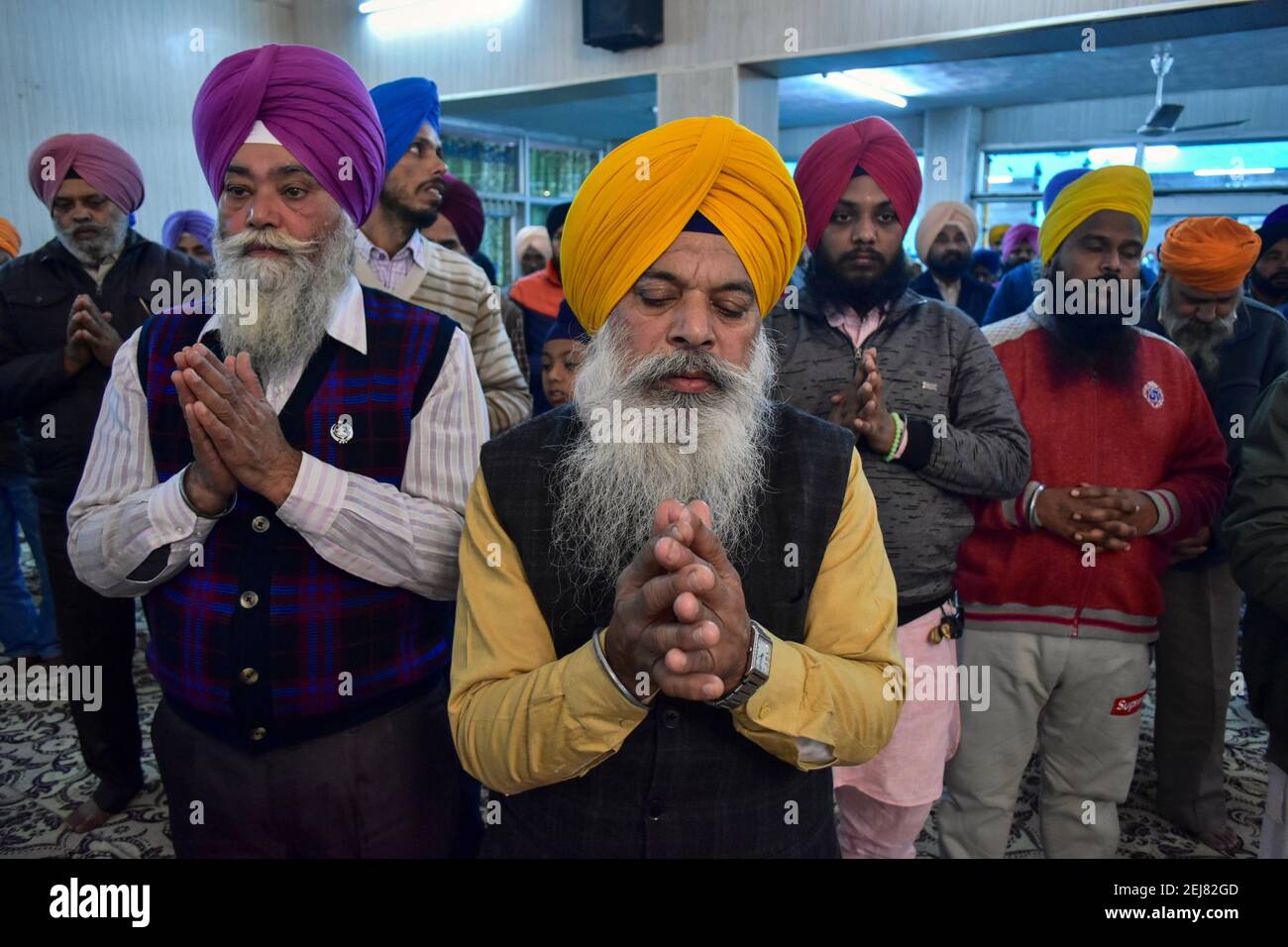 Devotees pray at the Sikh temple during the 353rd birth anniversary of ...