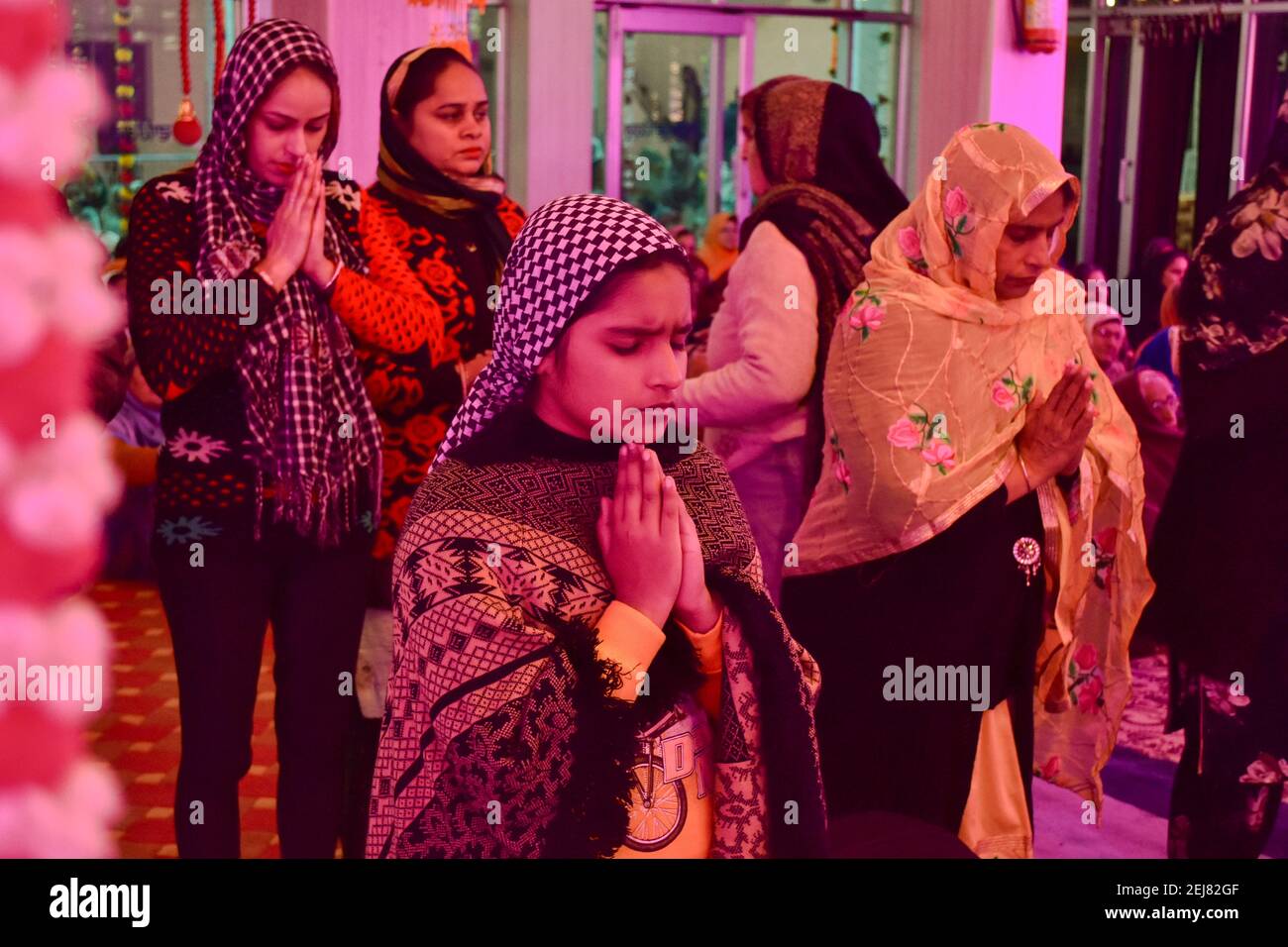 Devotees pray at the Sikh temple during the 353rd birth anniversary of ...