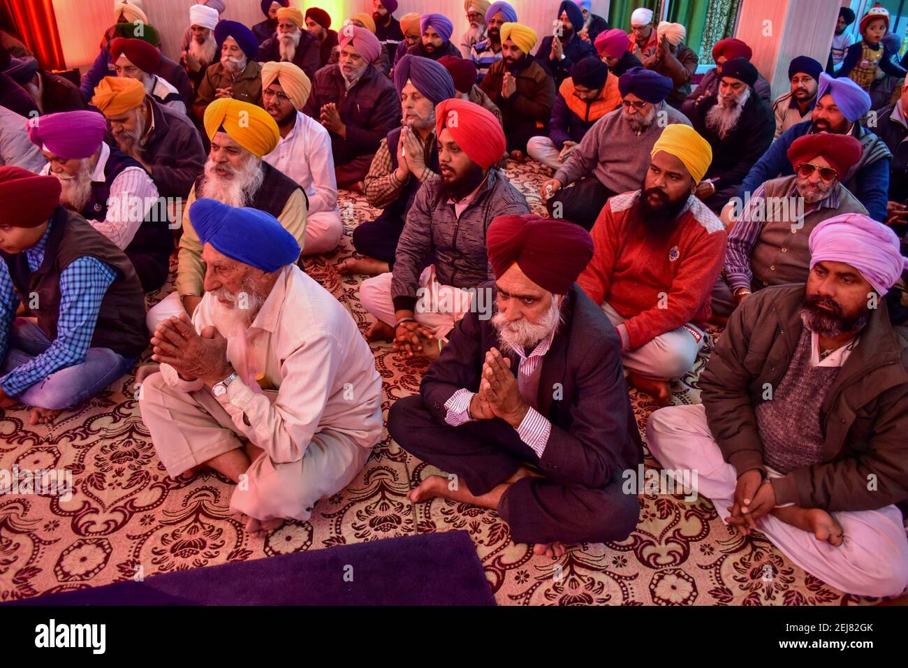 Devotees pray at the Sikh temple during the 353rd birth anniversary of ...