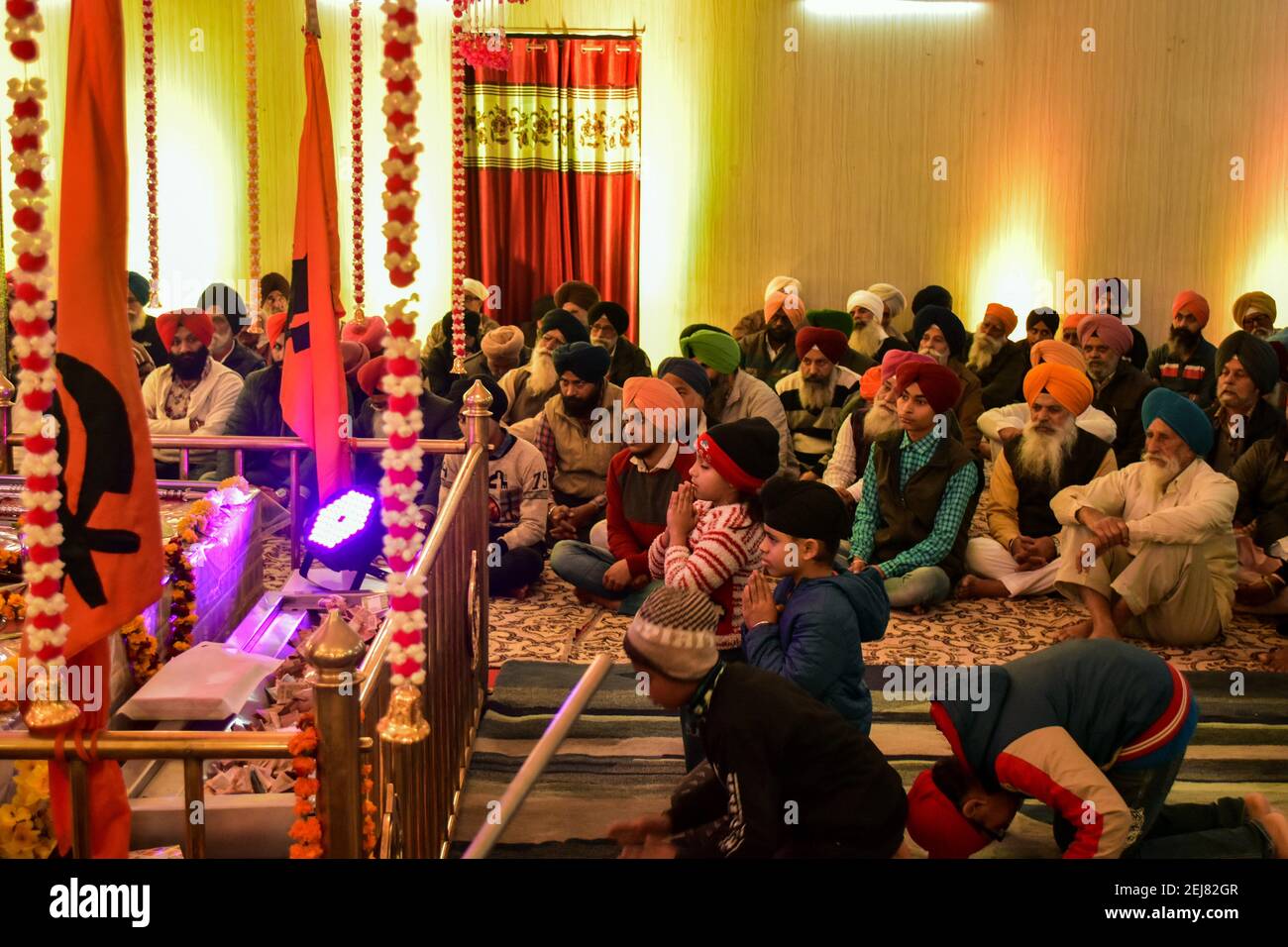 Devotees pray at the Sikh temple during the 353rd birth anniversary of ...