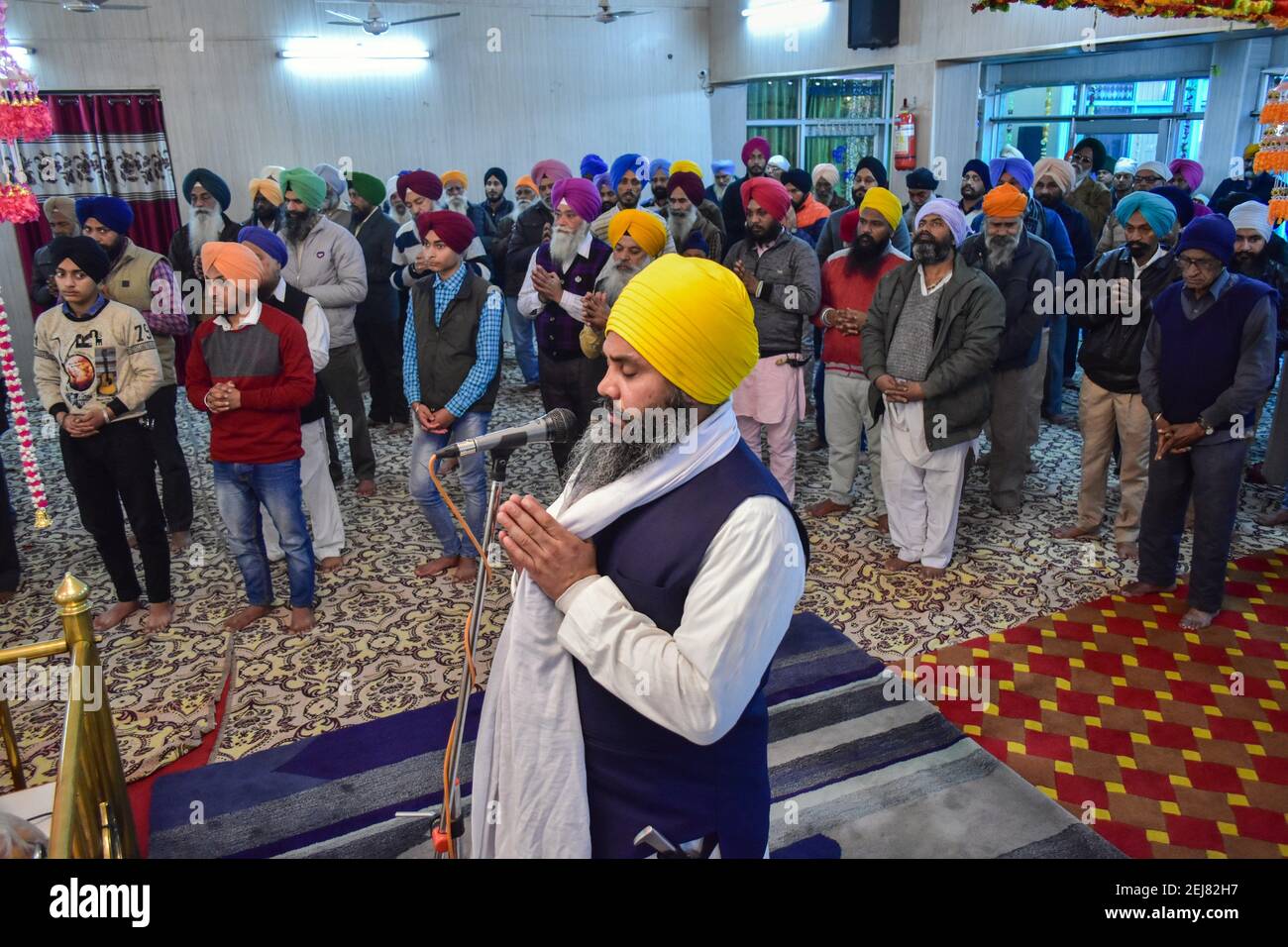 Devotees pray at the Sikh temple during the 353rd birth anniversary of ...
