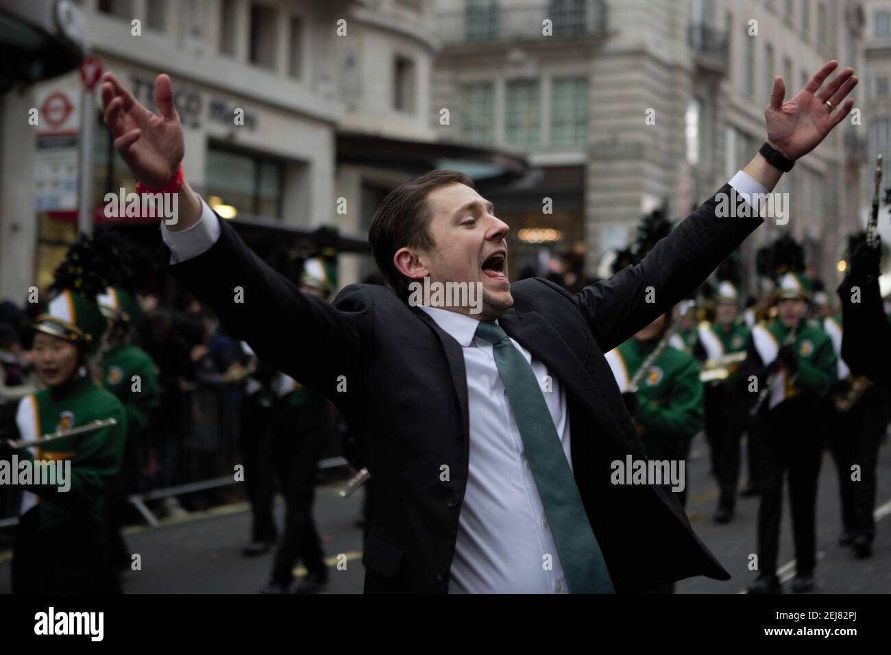 Leader of American High School Marching Band greets the public during ...