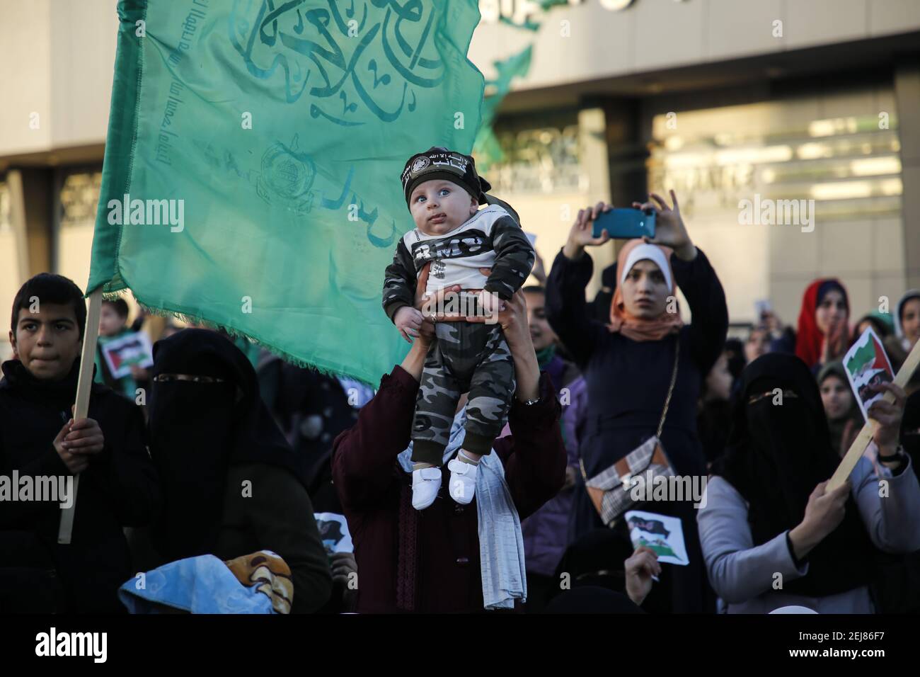 A Palestinian child is being carried during a protest in solidarity ...