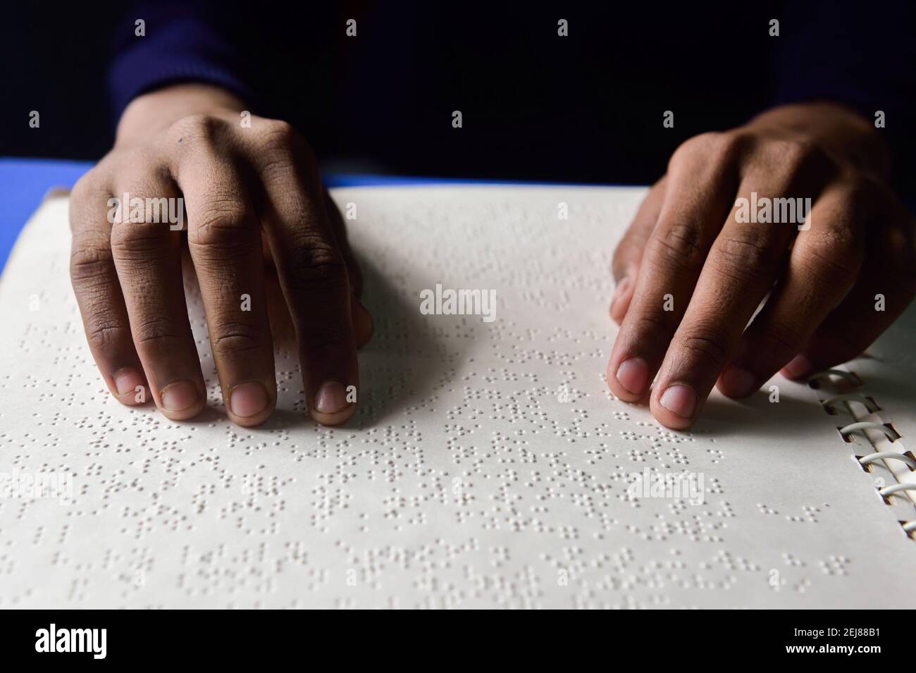 Visually impaired student reads with the help of braille fonts on World ...