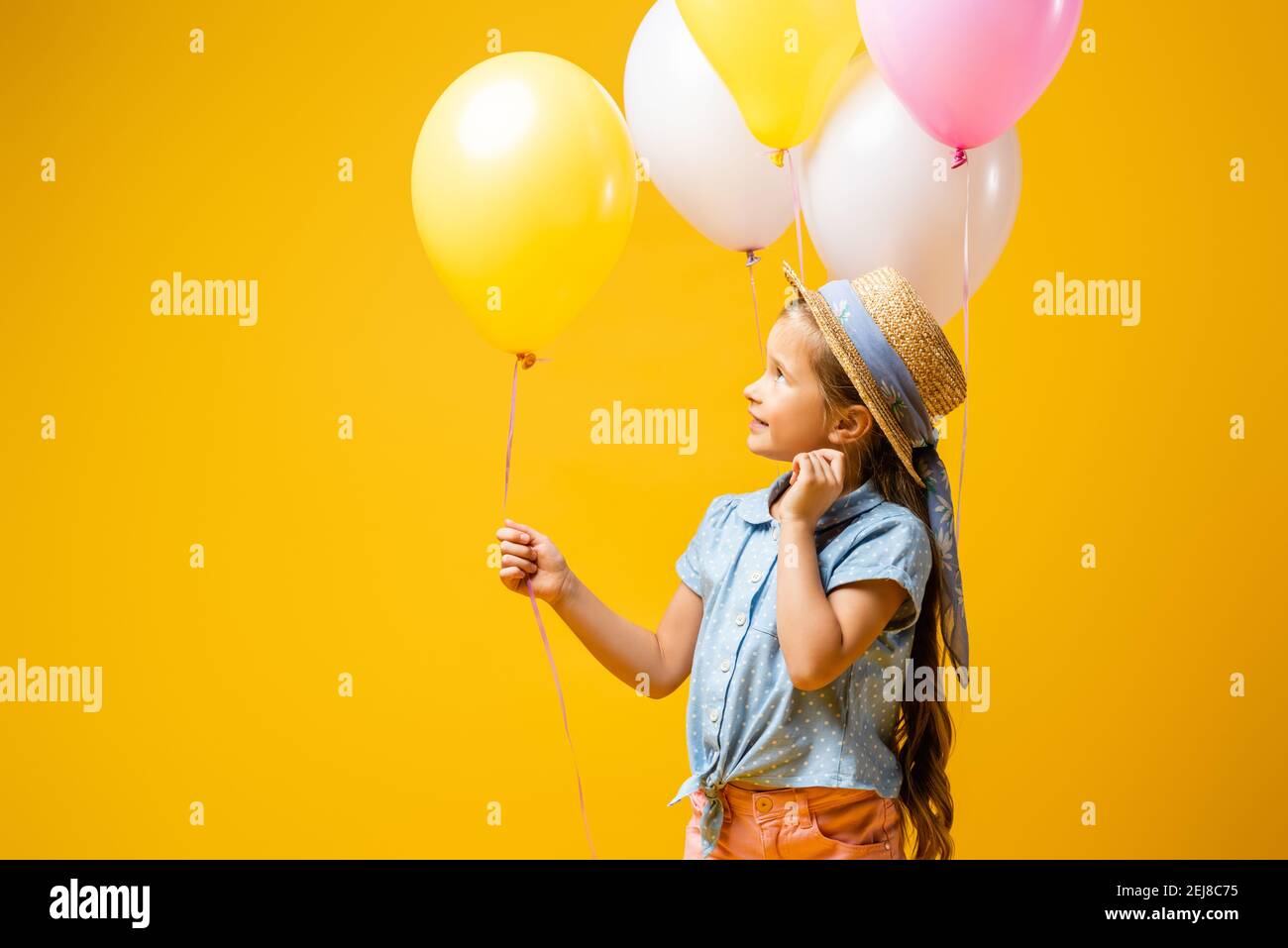 Adorable yellow party hat hi-res stock photography and images - Alamy