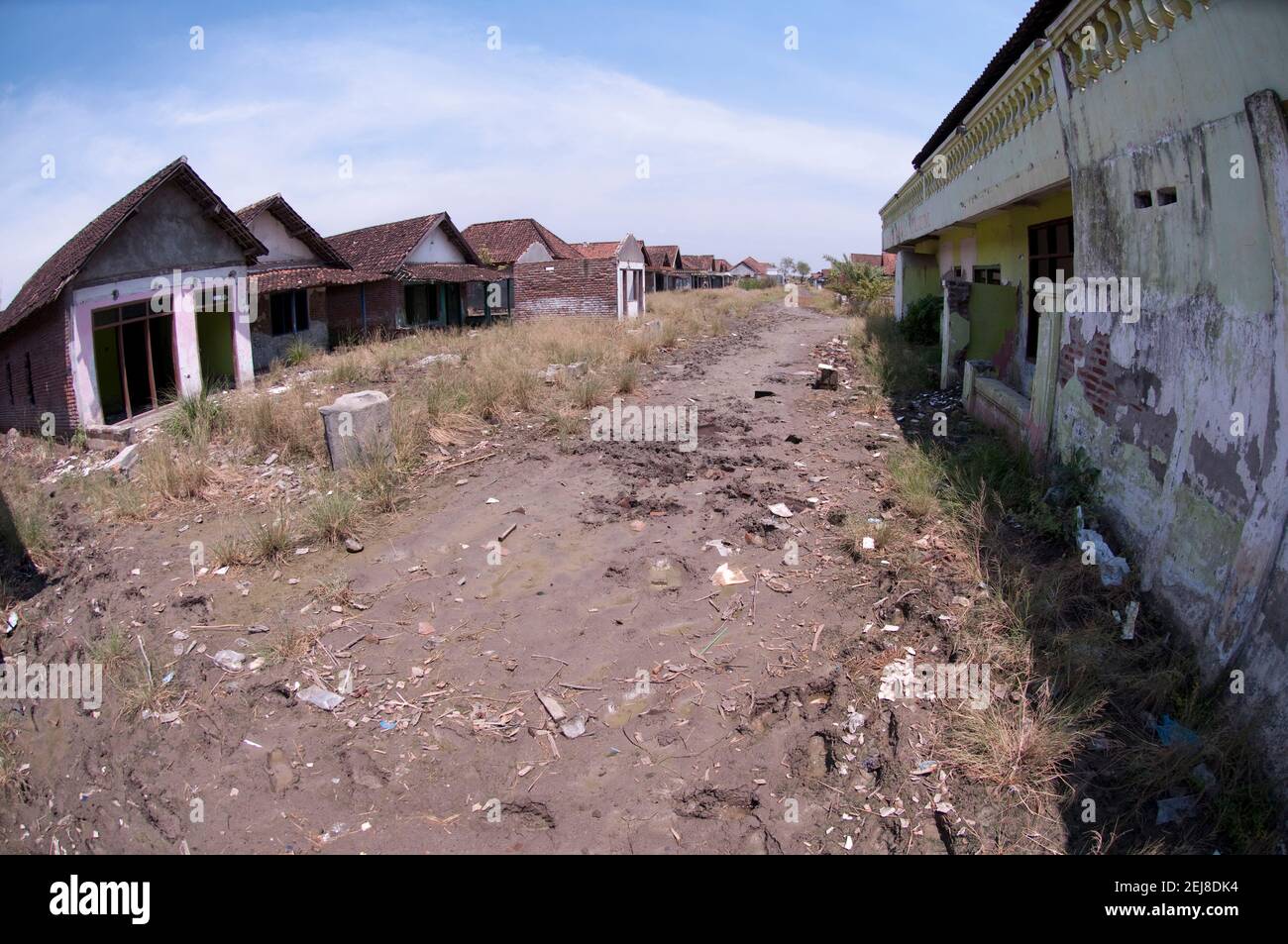 Abandoned village in dried mud following flooding by mud lake ...