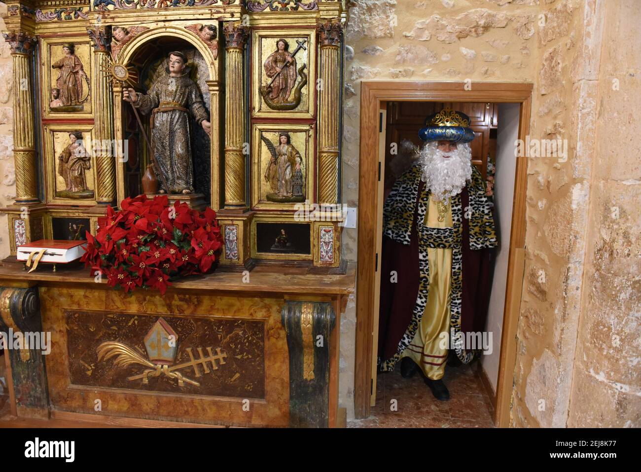 A performer dressed as Gaspar King is seen inside a church after the ...