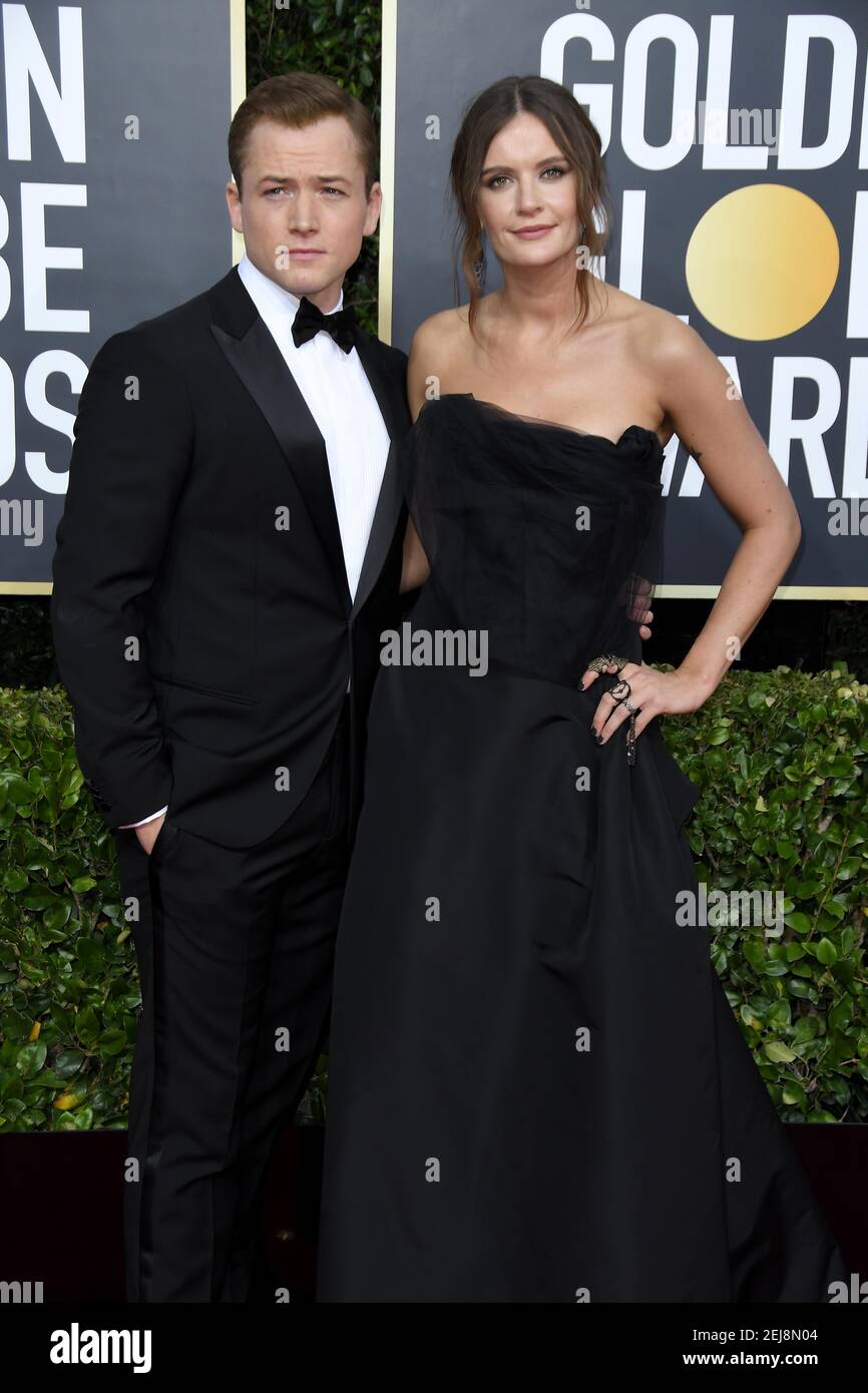 Taron Egerton and Emily Thomas arrives at the 77th Golden Globe Awards ...