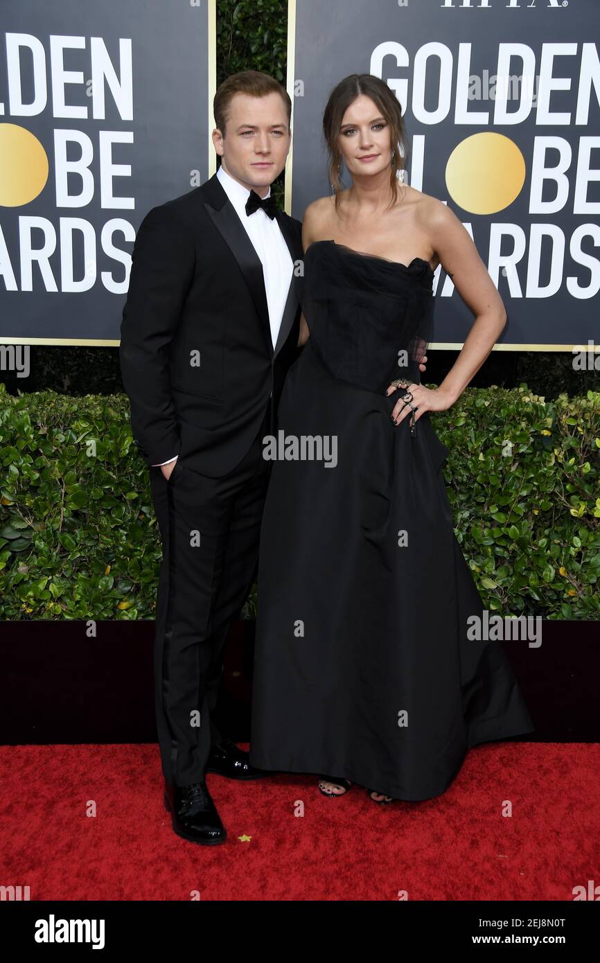 Taron Egerton and Emily Thomas arrives at the 77th Golden Globe Awards ...