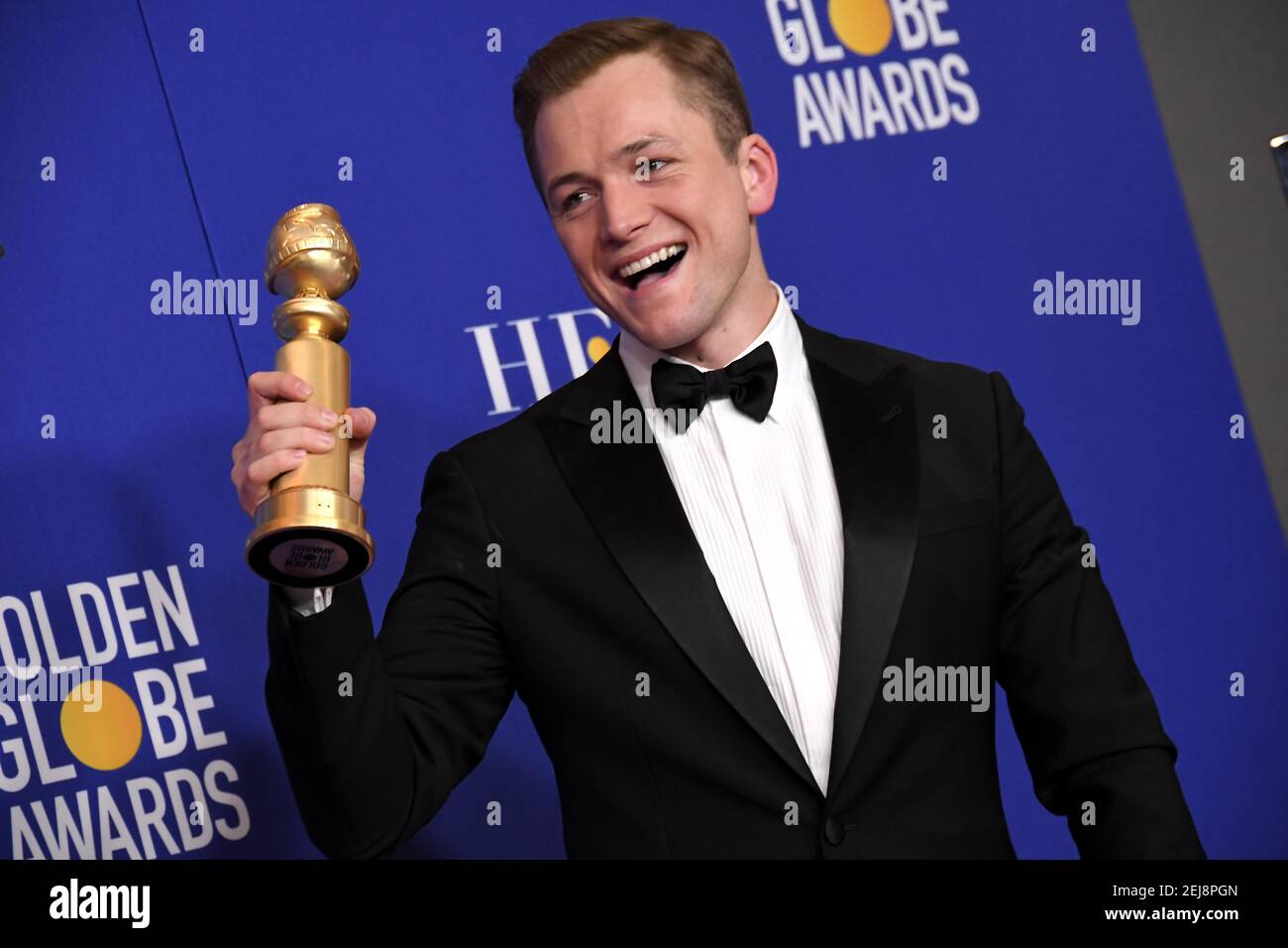 Taron Egerton poses in the press room with the award for best Best ...