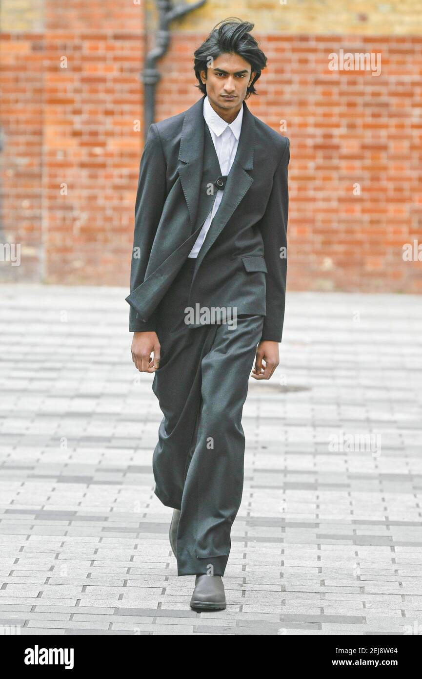 Model walks on the runway during the Hussein Chalayan show , London ...