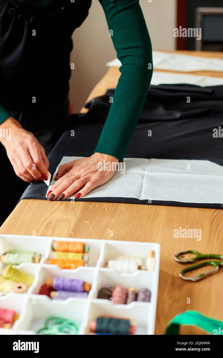 Step by step, Woman dressmaker female making sewing patterns, Mature ...