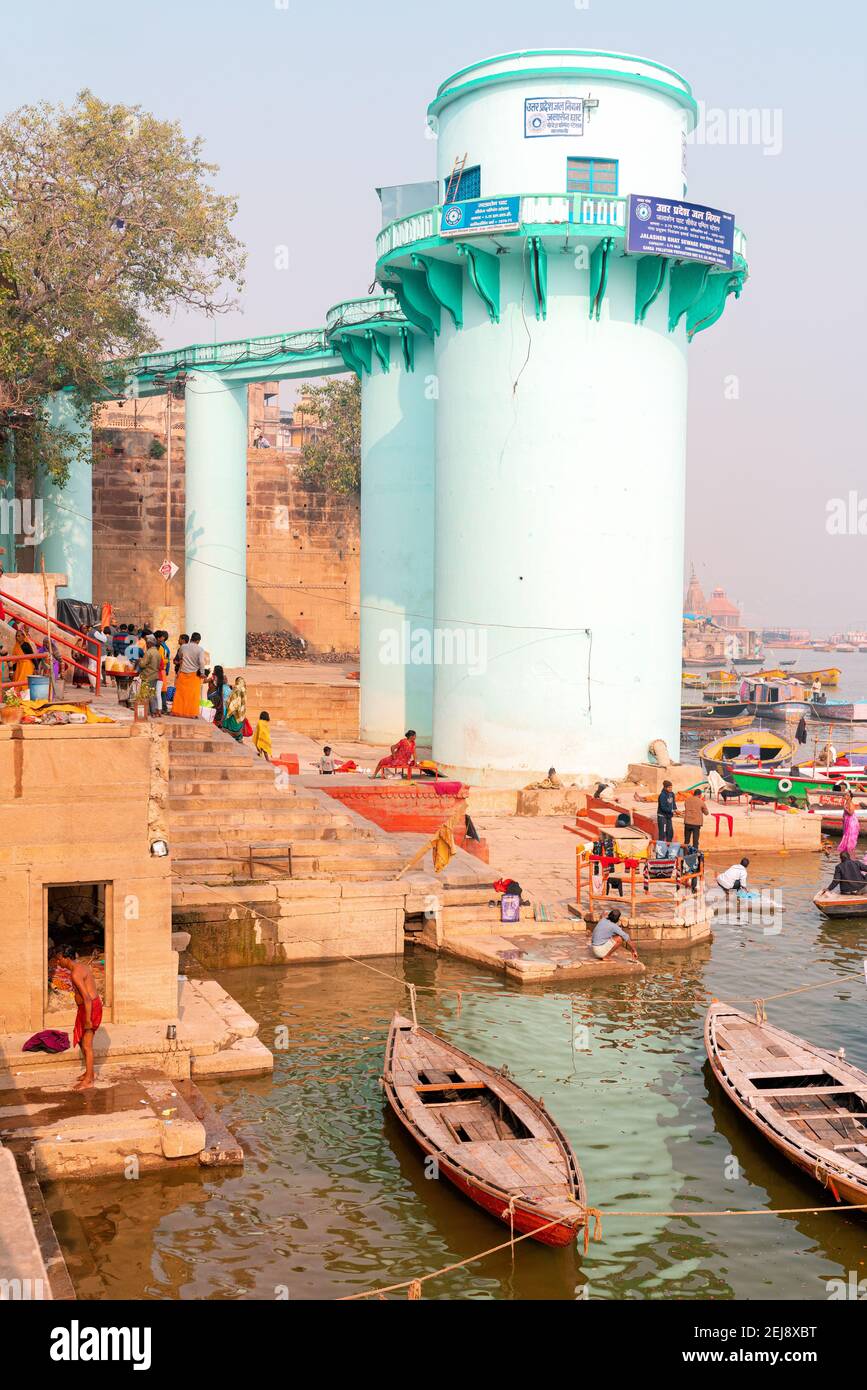 22.12.2019 Varanasi, India. View of the river pier with a lighthouse ...