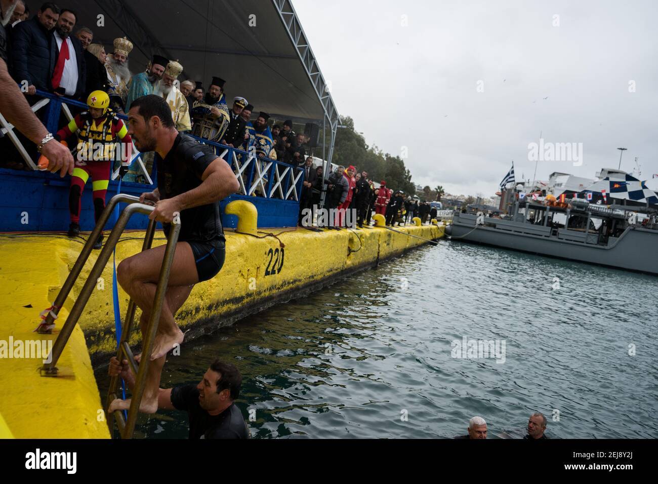 A Greek orthodox believer seen getting out of the cold water during the ...