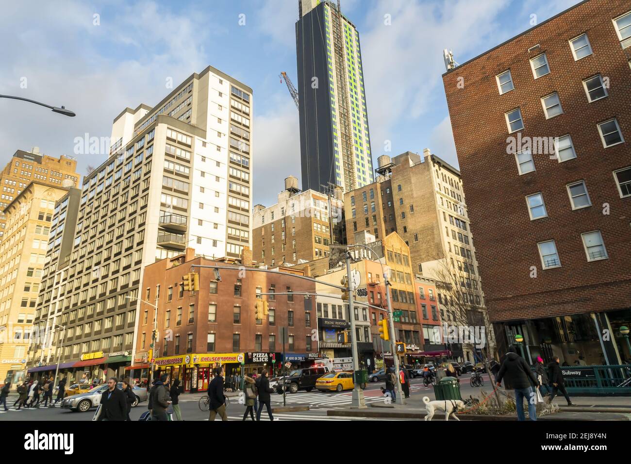 Development in the Chelsea neighborhood of New York towers above low ...
