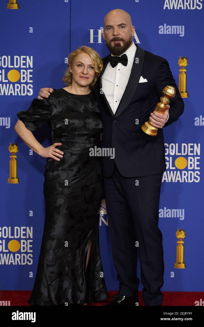 Arianne Sutner, left, and Chris Butler pose in the press room with the ...