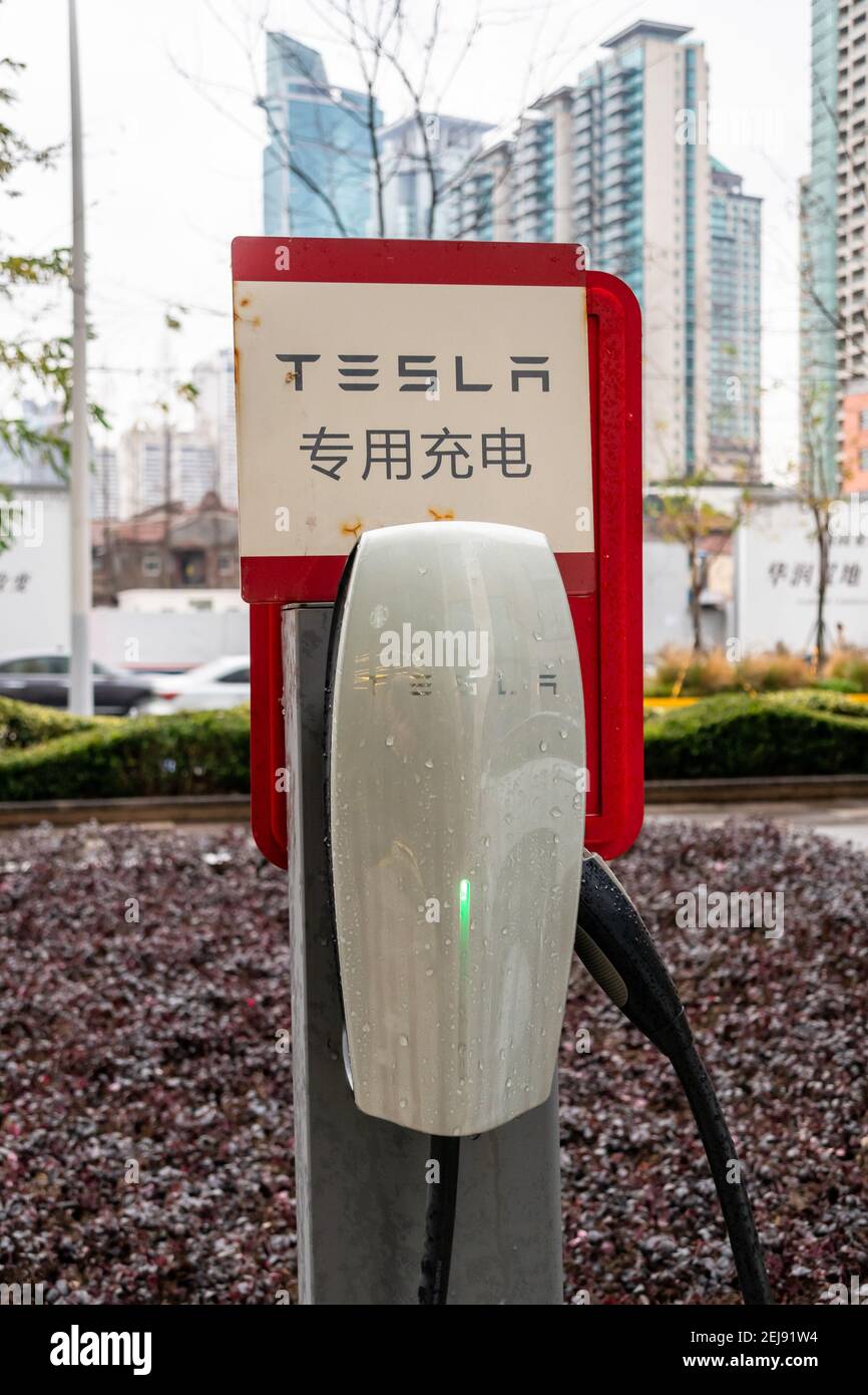 A recharging plug is seen at a Tesla store in Shanghai, China on ...