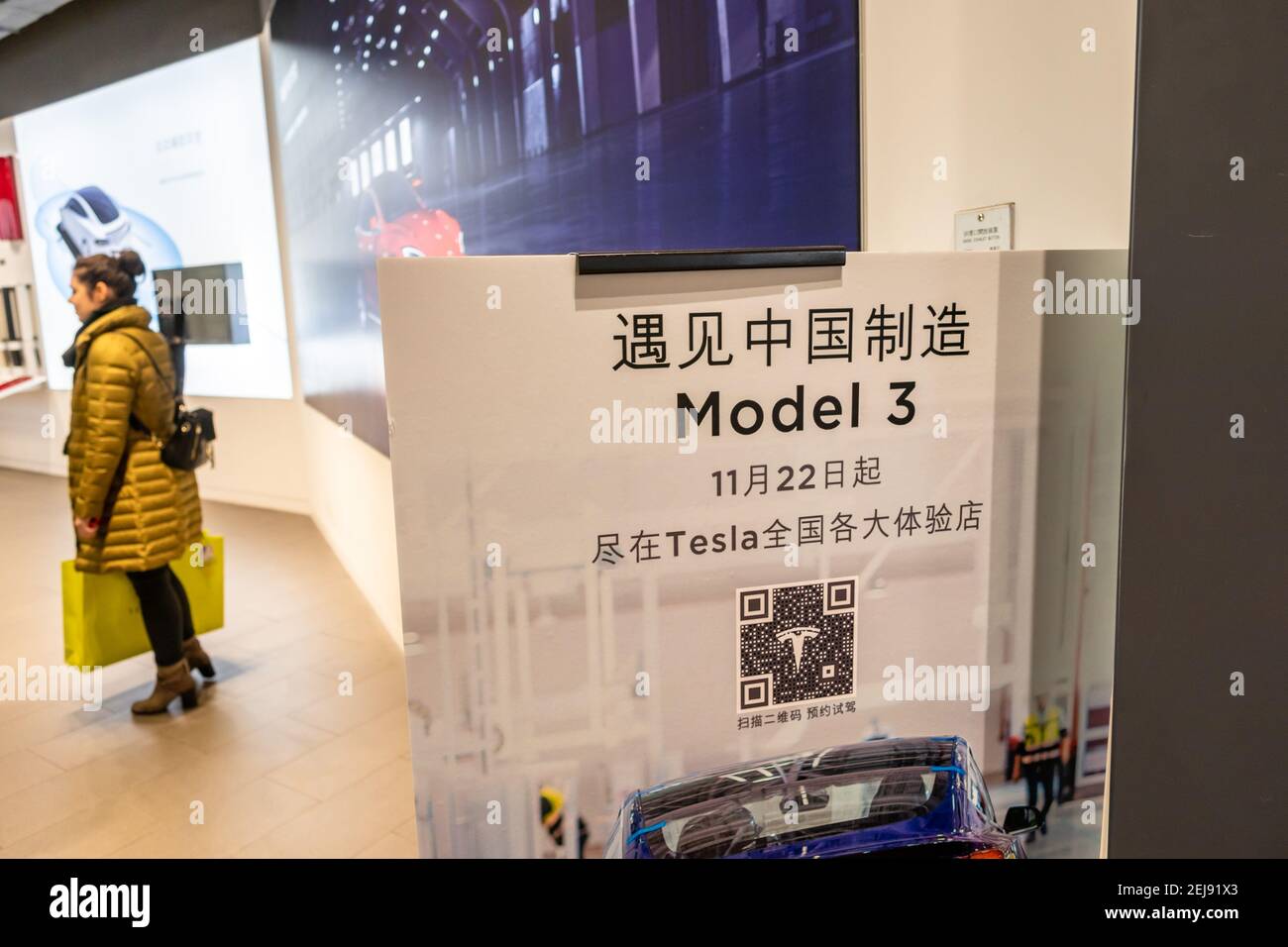 An advertising poster for the domestically-manufactured Tesla Model 3 ...