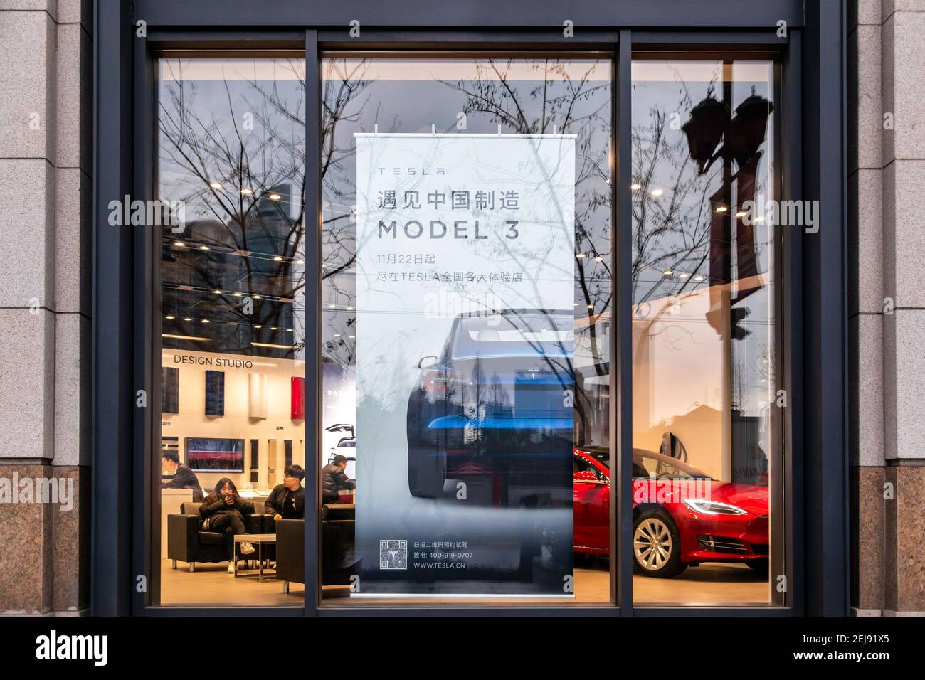 An advertising poster for the domestically-manufactured Tesla Model 3 ...