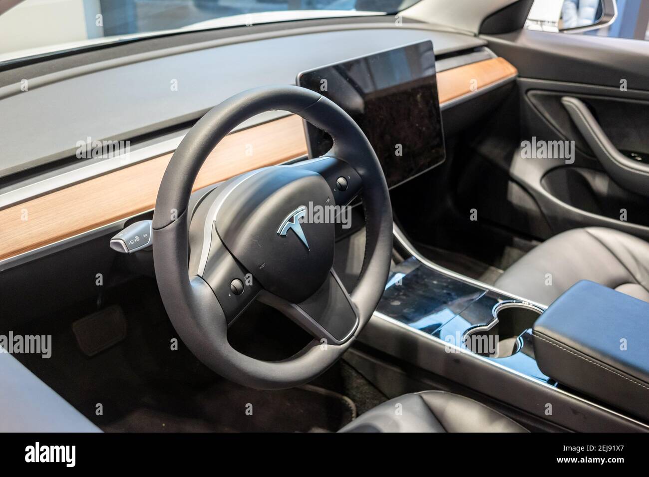 A domestically-manufactured Tesla Model 3 electric car is on display at ...