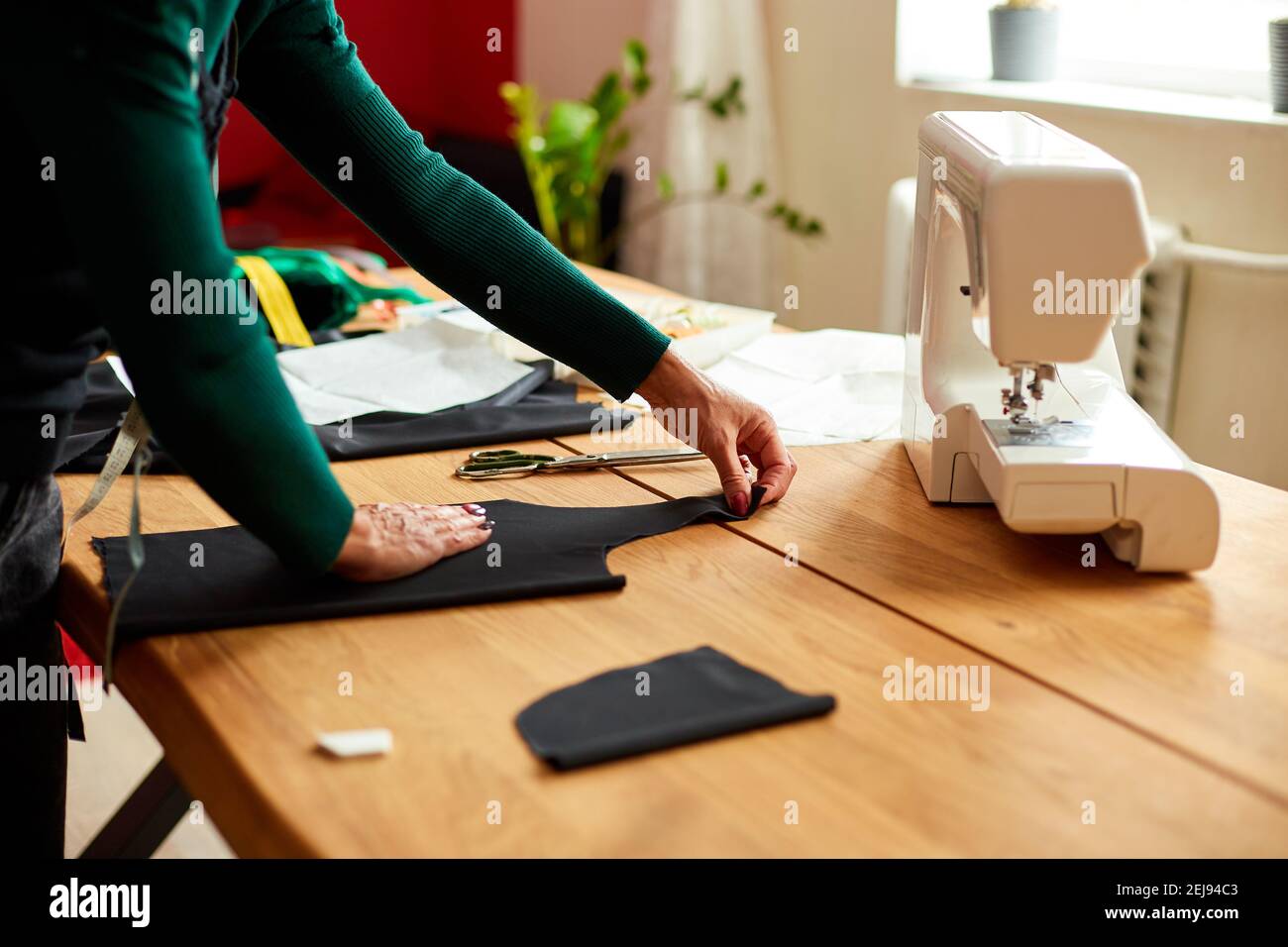 Step by step, woman dressmaker female measuring sewing pattern On Table ...